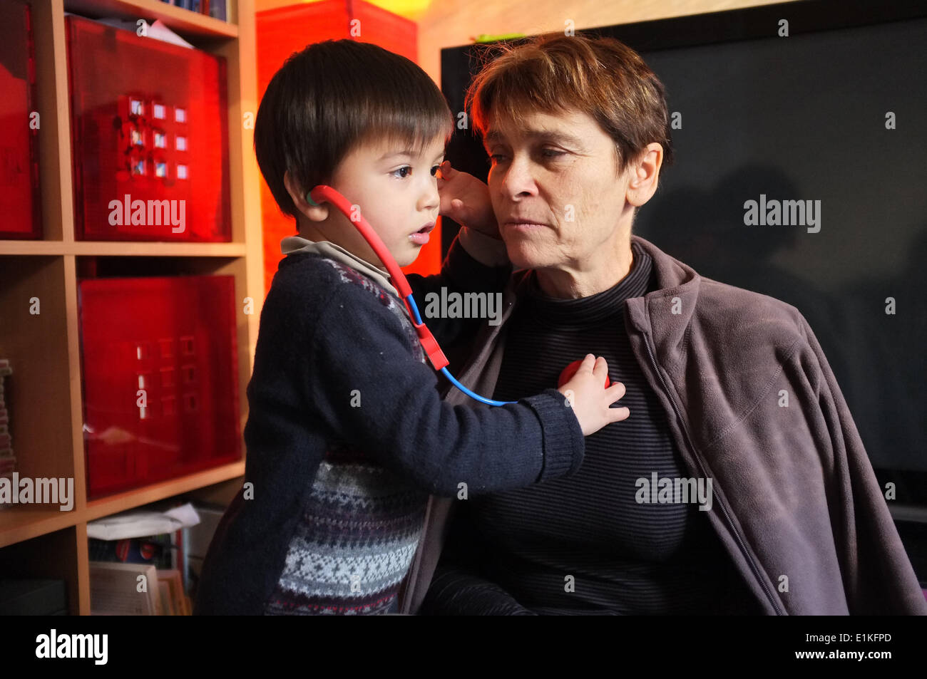 Grandmother and son playing doctor Stock Photo - Alamy