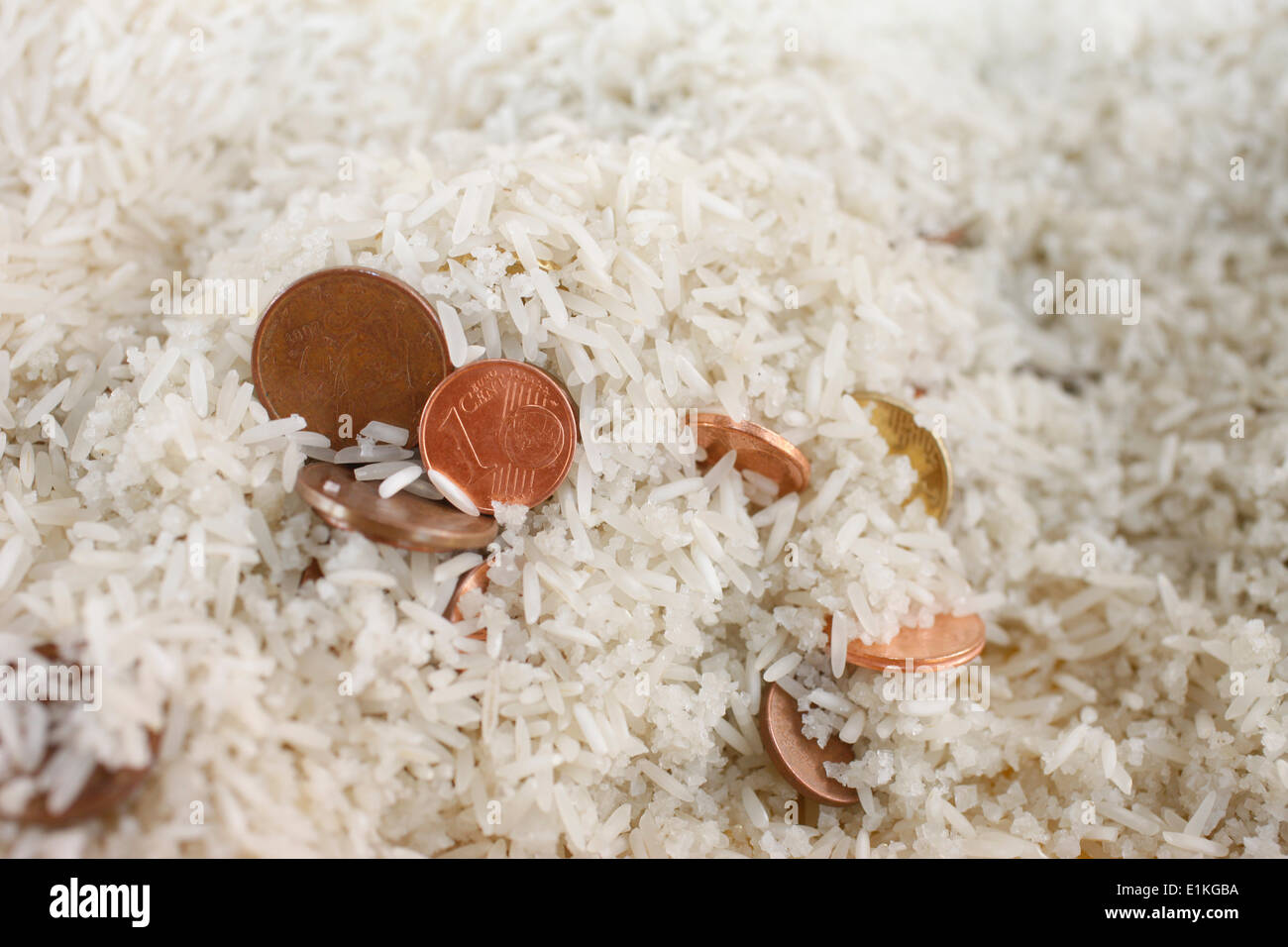 Rice and coin Buddhist offering Stock Photo - Alamy