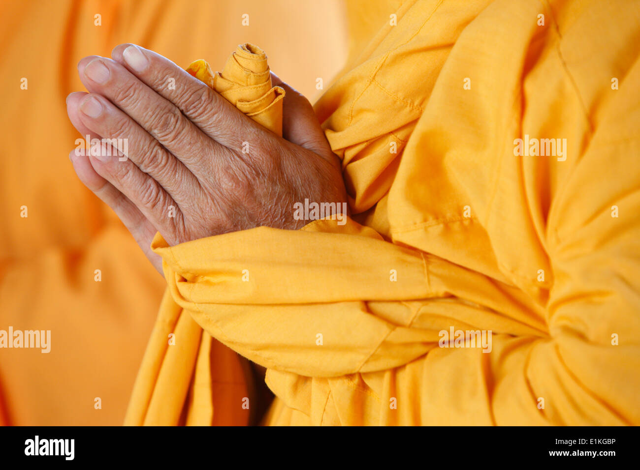 Praying Buddhist monk Stock Photo - Alamy