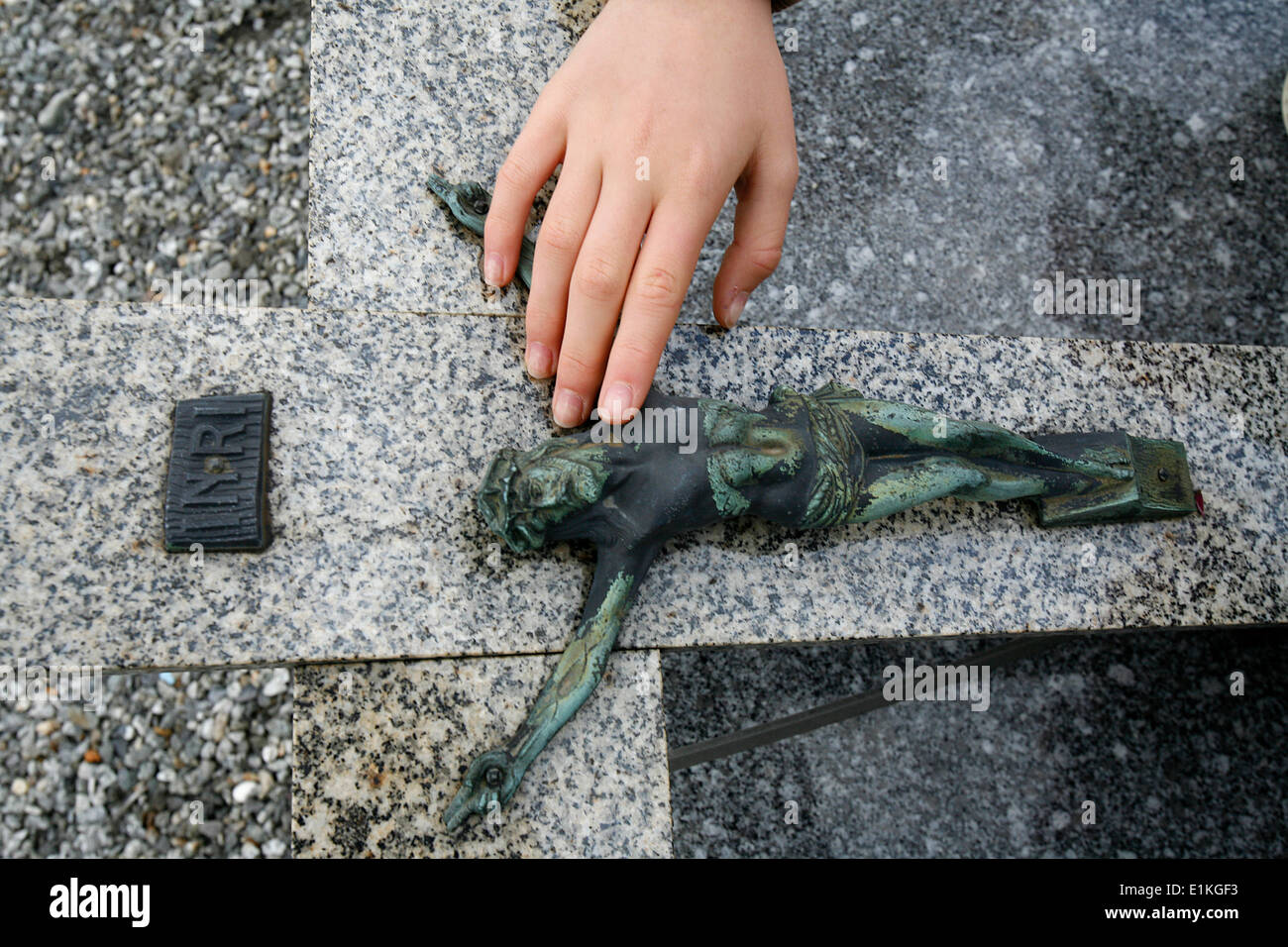 Hand on cross Stock Photo - Alamy