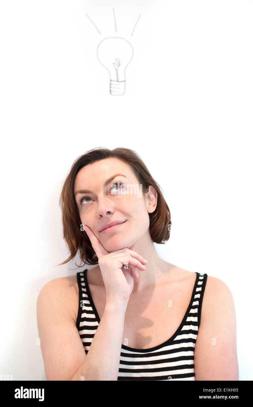 Woman and lightbulb hi-res stock photography and images - Alamy