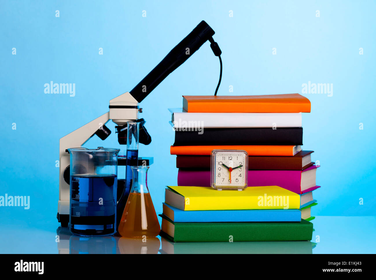 Microscope books and chemistry equipment still life Stock Photo - Alamy