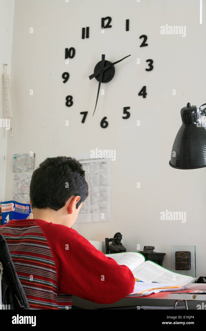 11-year old boy doing homework Stock Photo - Alamy