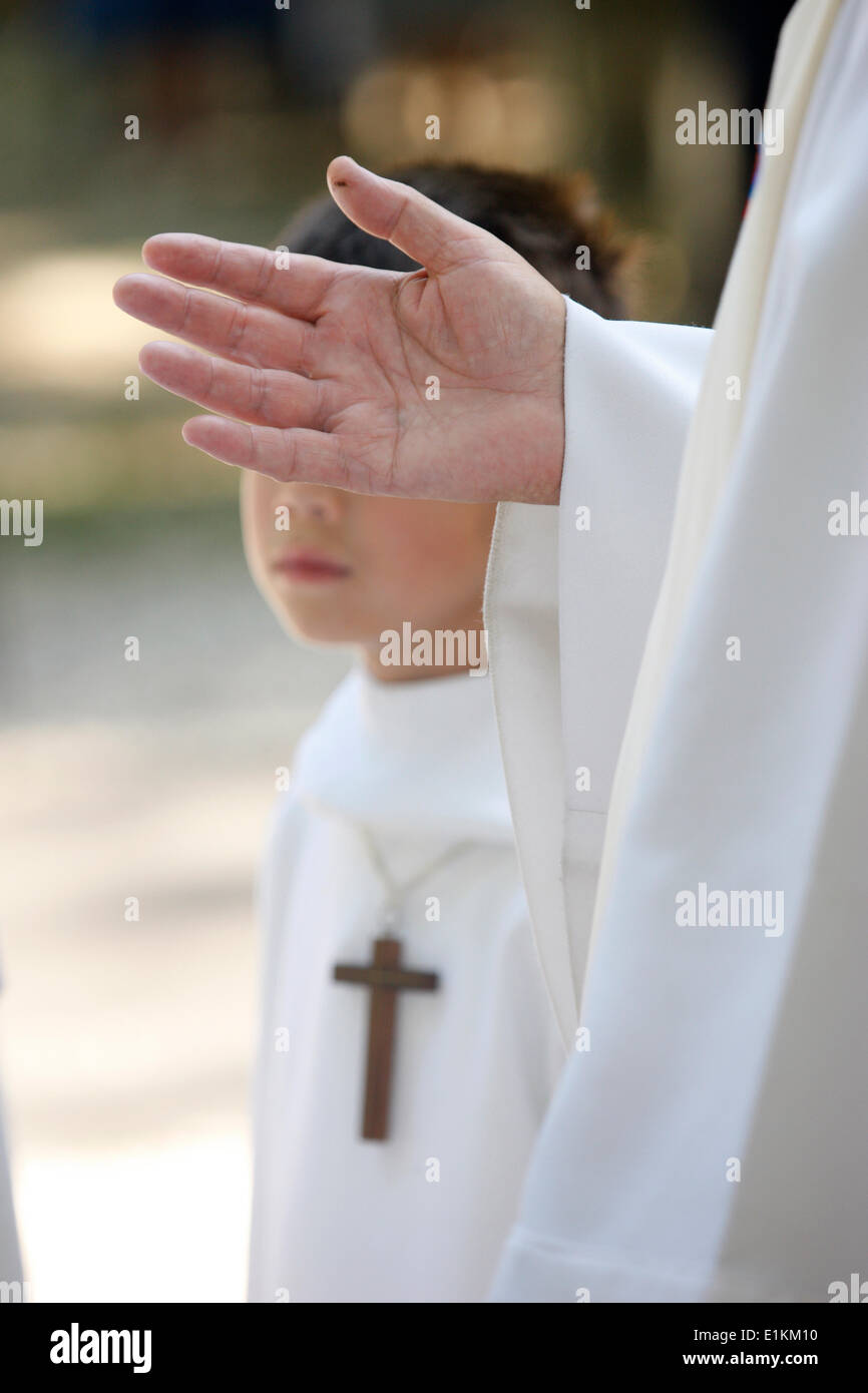 Priest and altar boy Stock Photo - Alamy