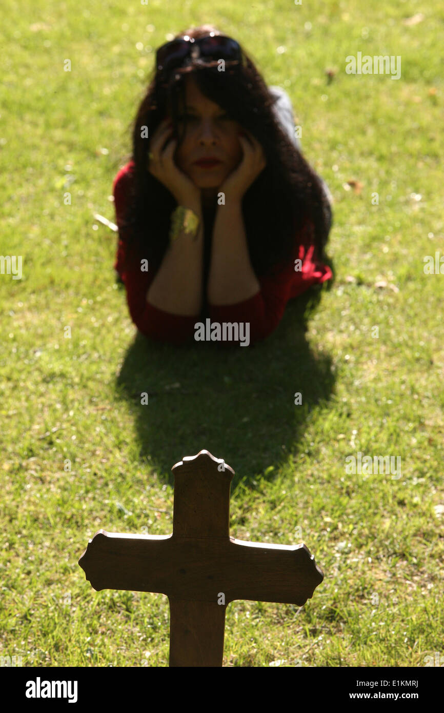 Woman praying outside Stock Photo - Alamy