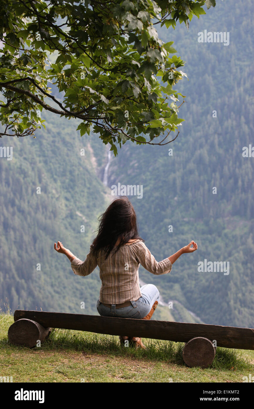 Woman praying outside Stock Photo - Alamy