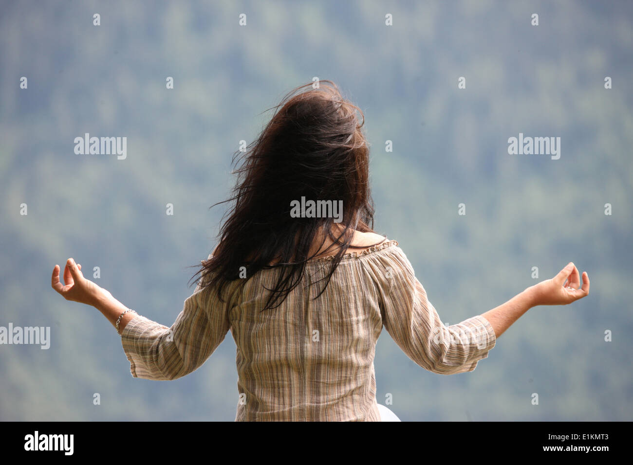 Woman praying outside Stock Photo - Alamy