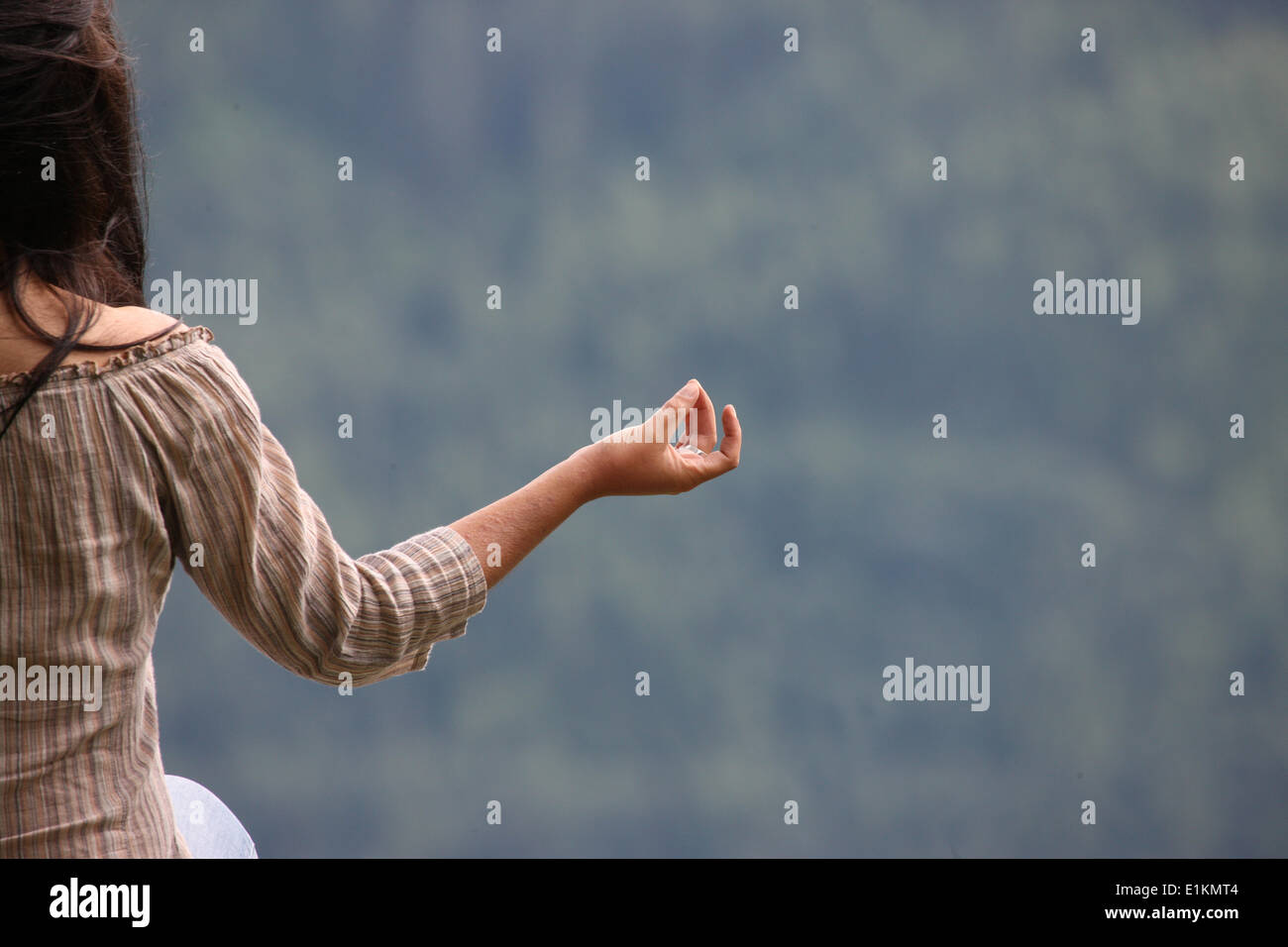 Woman praying outside Stock Photo - Alamy