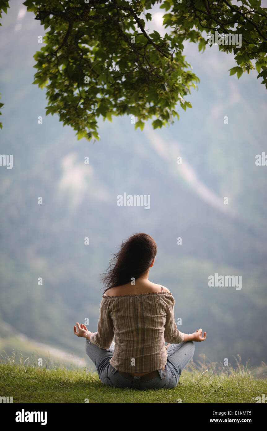 Woman praying outside Stock Photo - Alamy