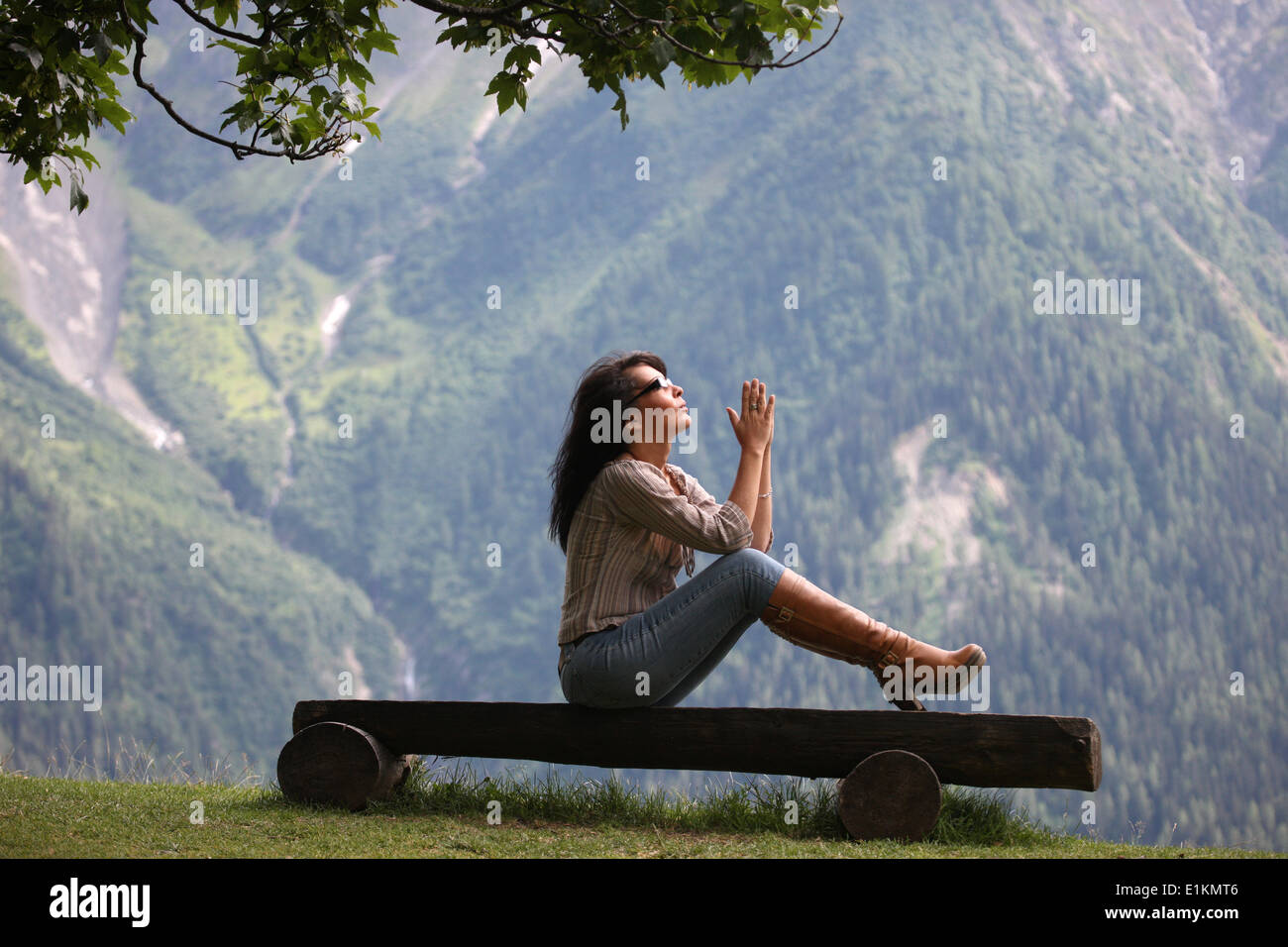 Woman praying outside Stock Photo - Alamy