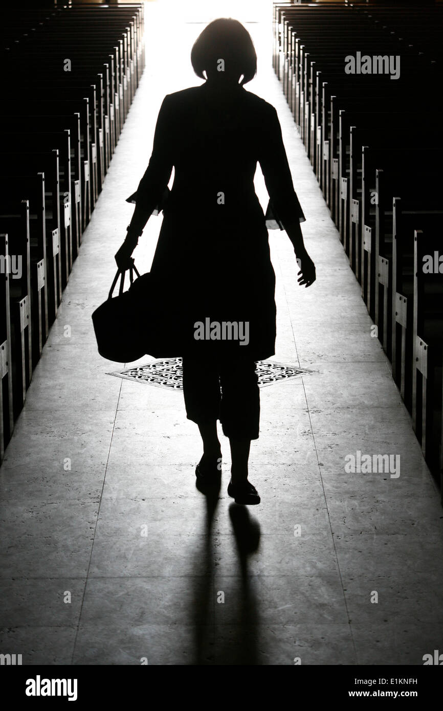 Woman in the church hi-res stock photography and images - Alamy