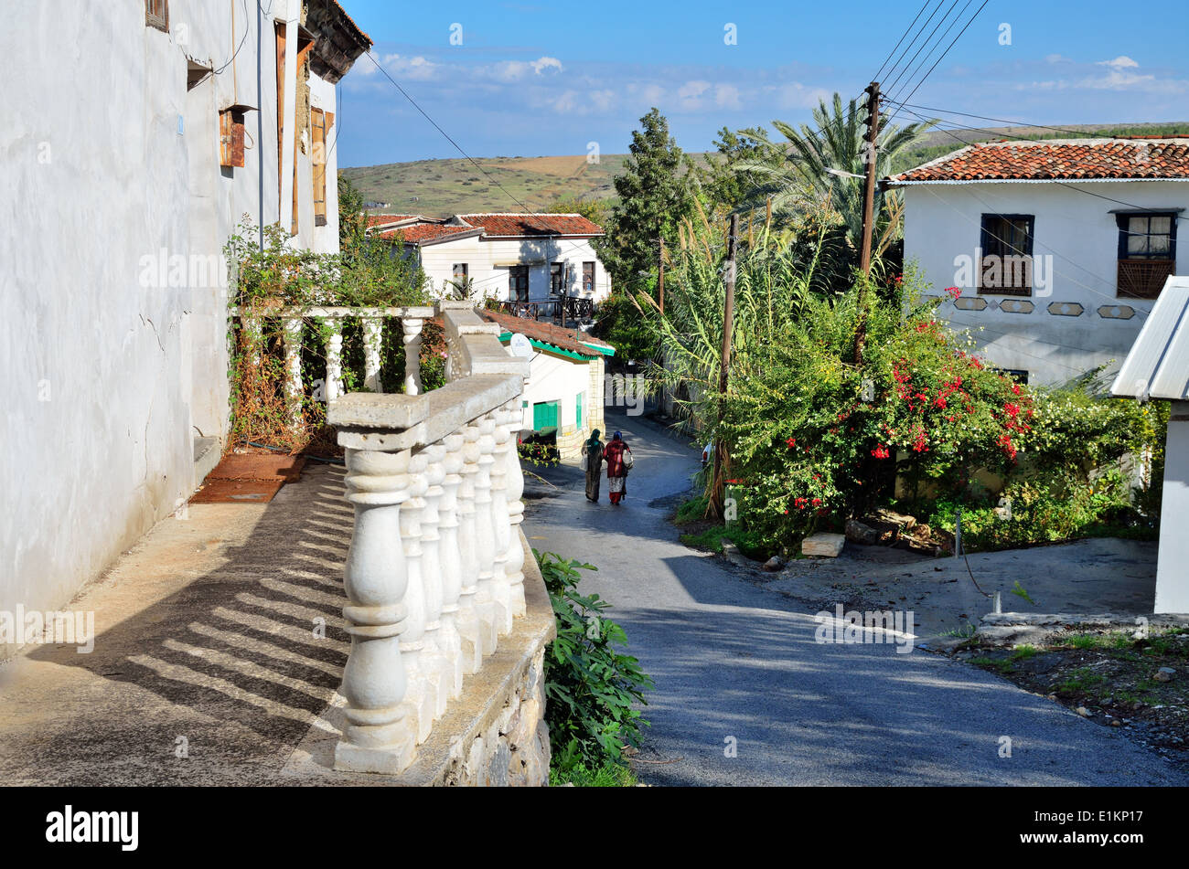 Muslim women walk down the street in Lefka, Northern Cyprus Stock Photo ...