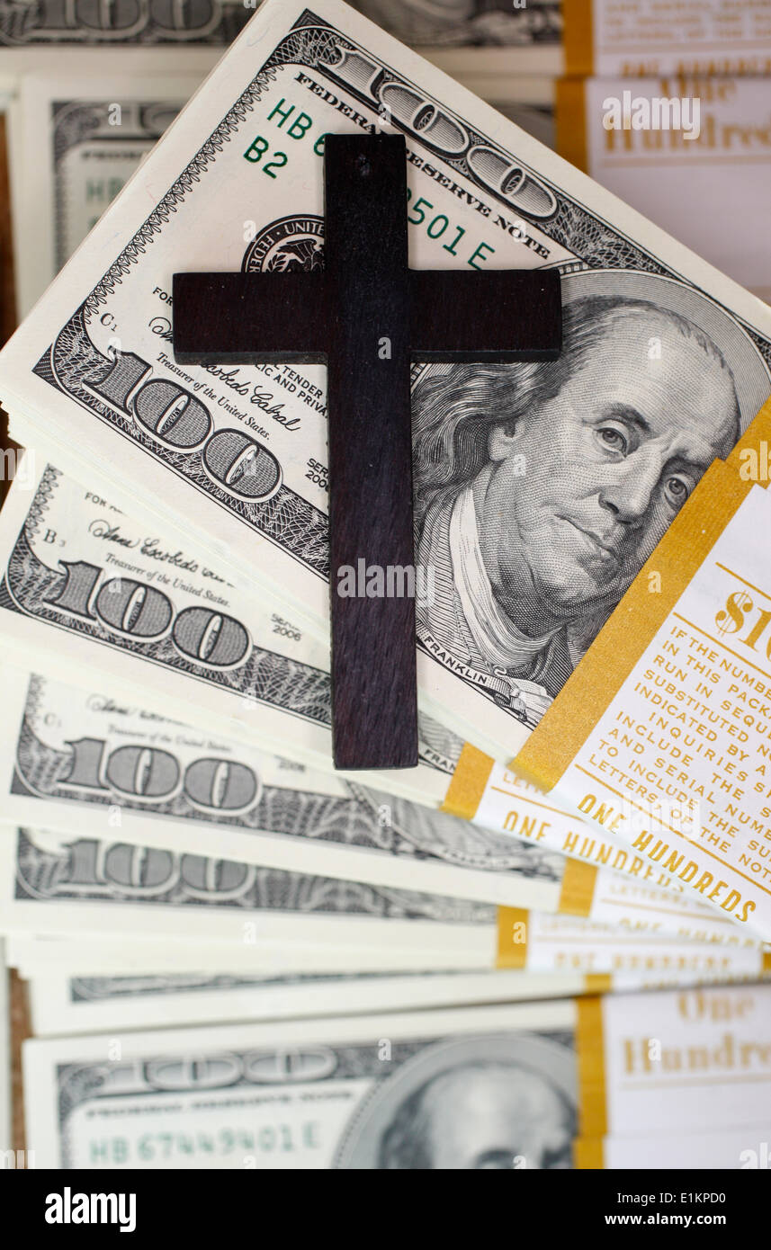 Cross and bank notes Stock Photo - Alamy