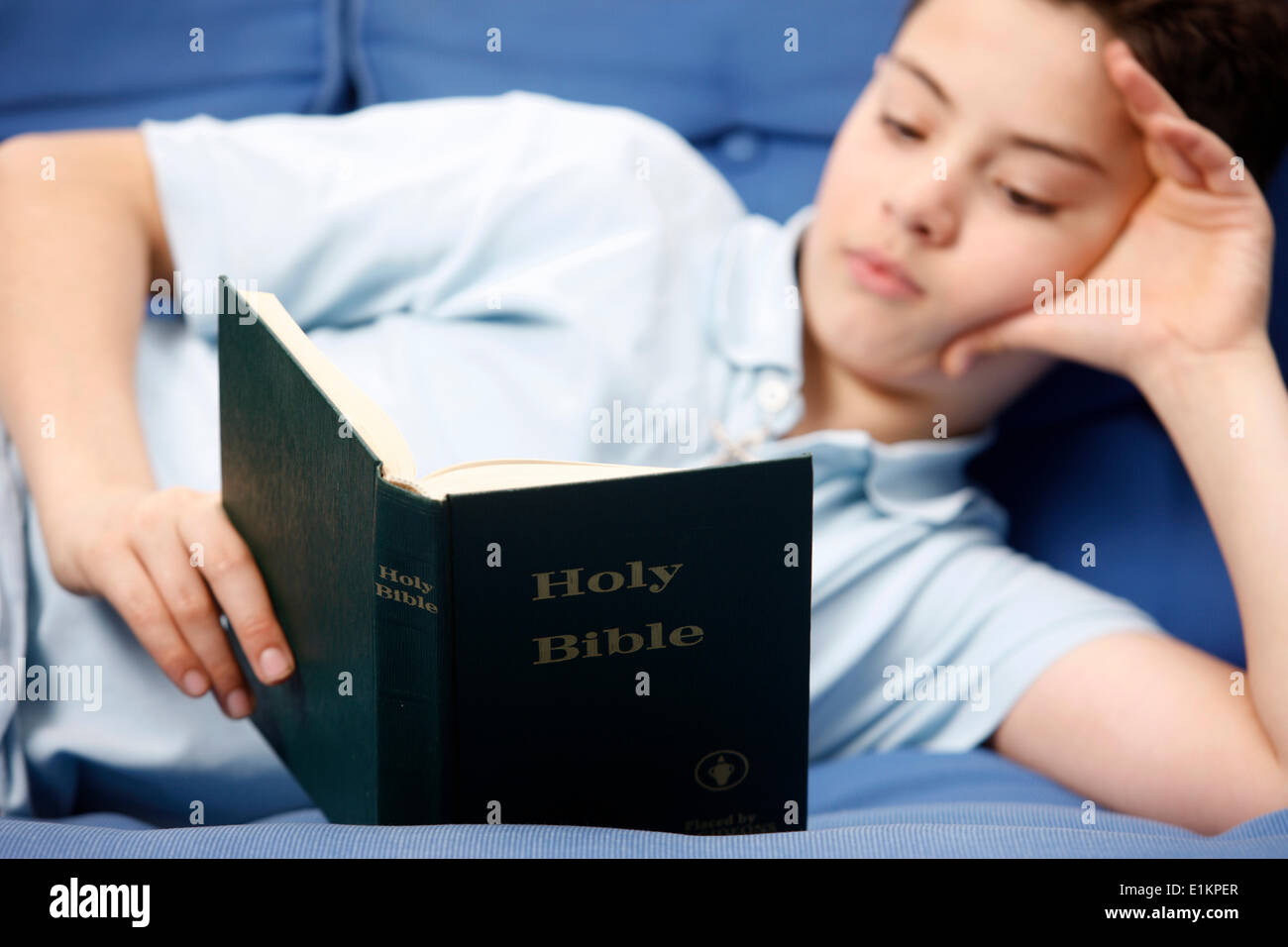Boy reading Bible Stock Photo - Alamy