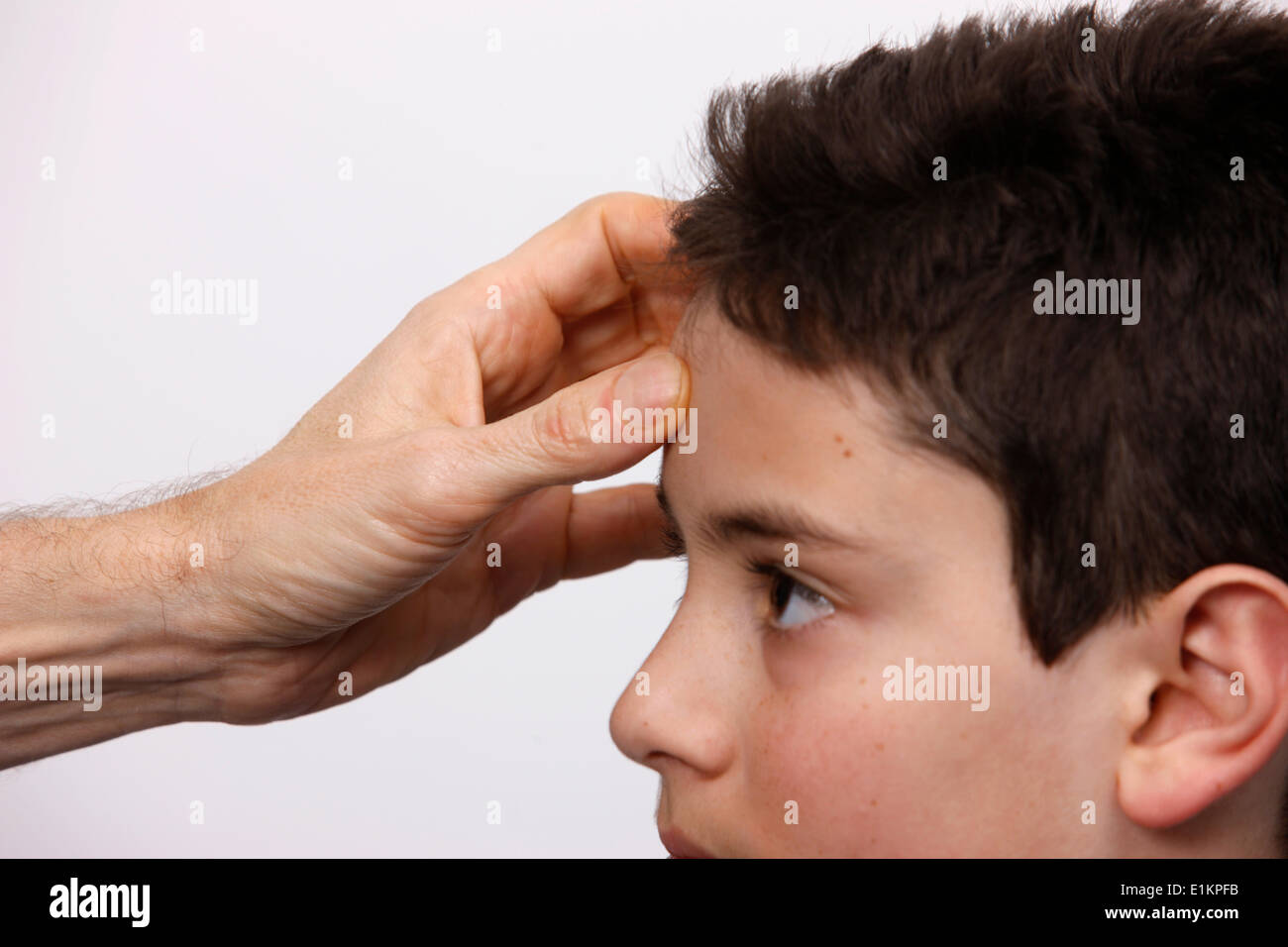 Anointing a boy Stock Photo - Alamy