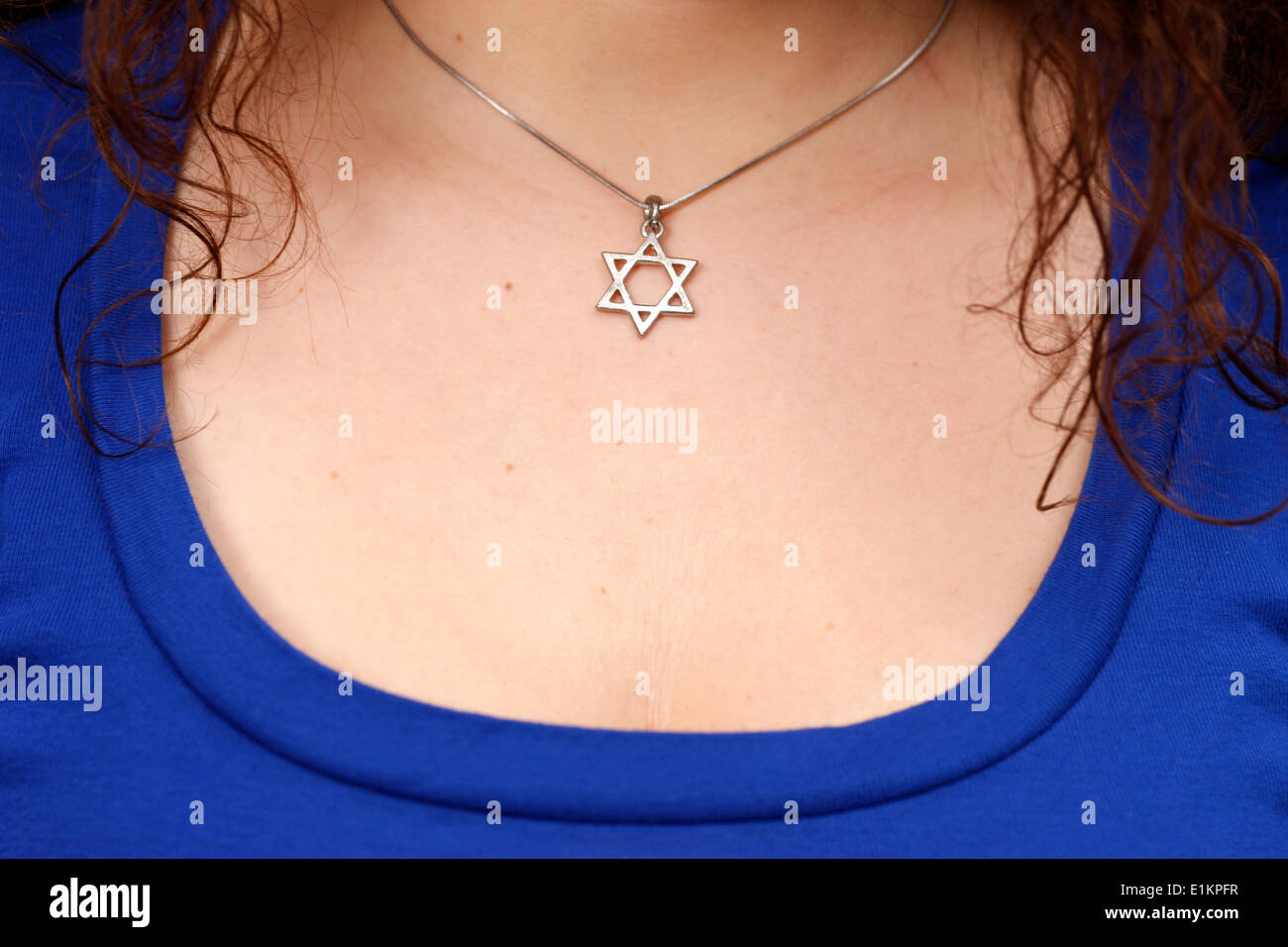 Young woman with a star of David necklace Stock Photo - Alamy