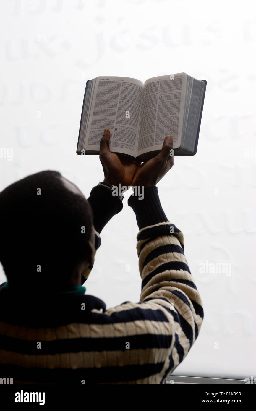 African man reading bible in hi-res stock photography and images - Alamy