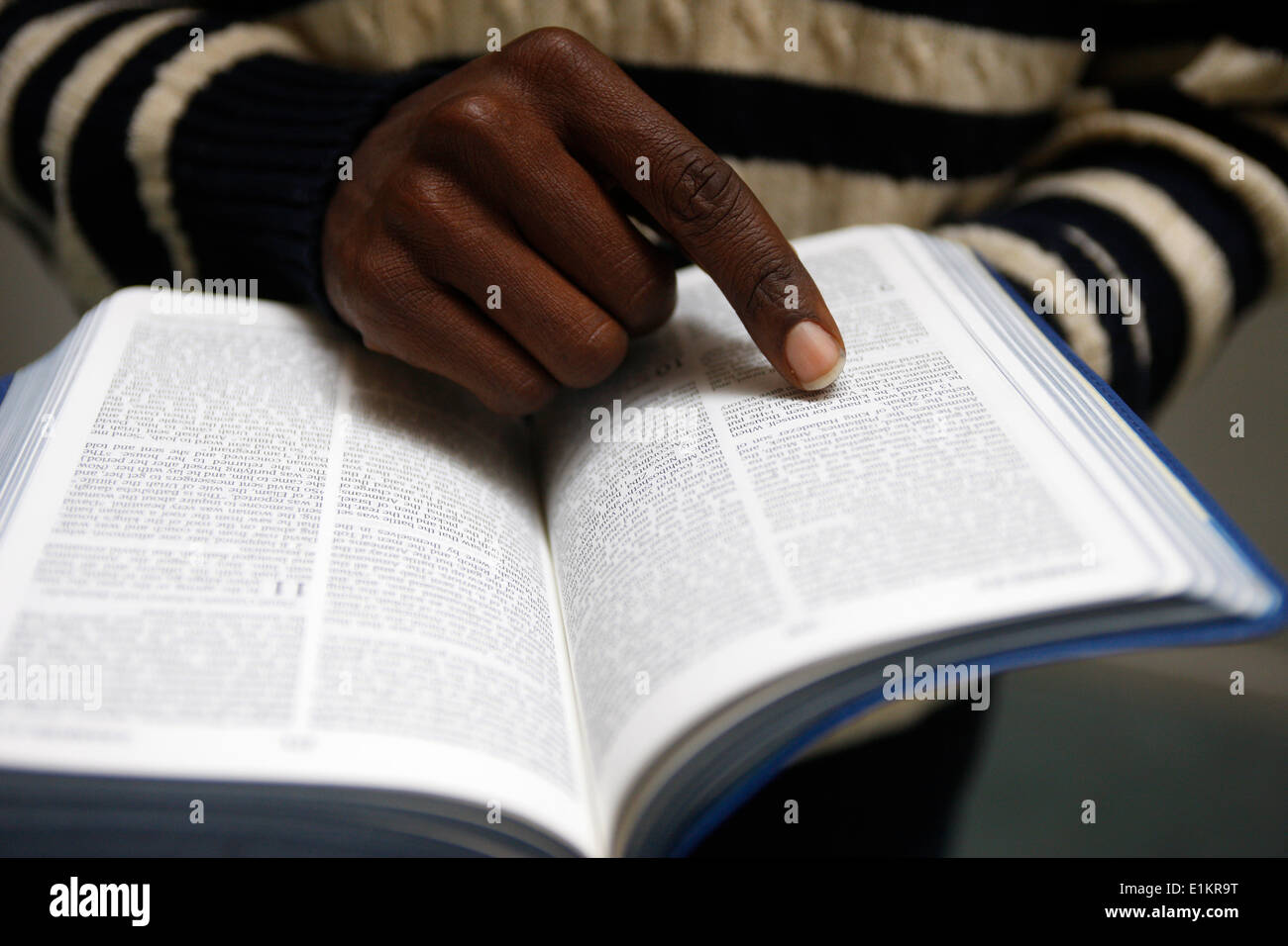 African man reading the bible in a church Stock Photo - Alamy