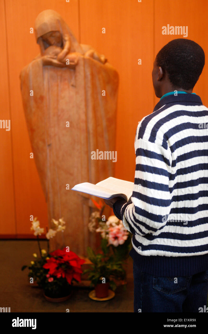 African man reading the bible in a church Stock Photo - Alamy