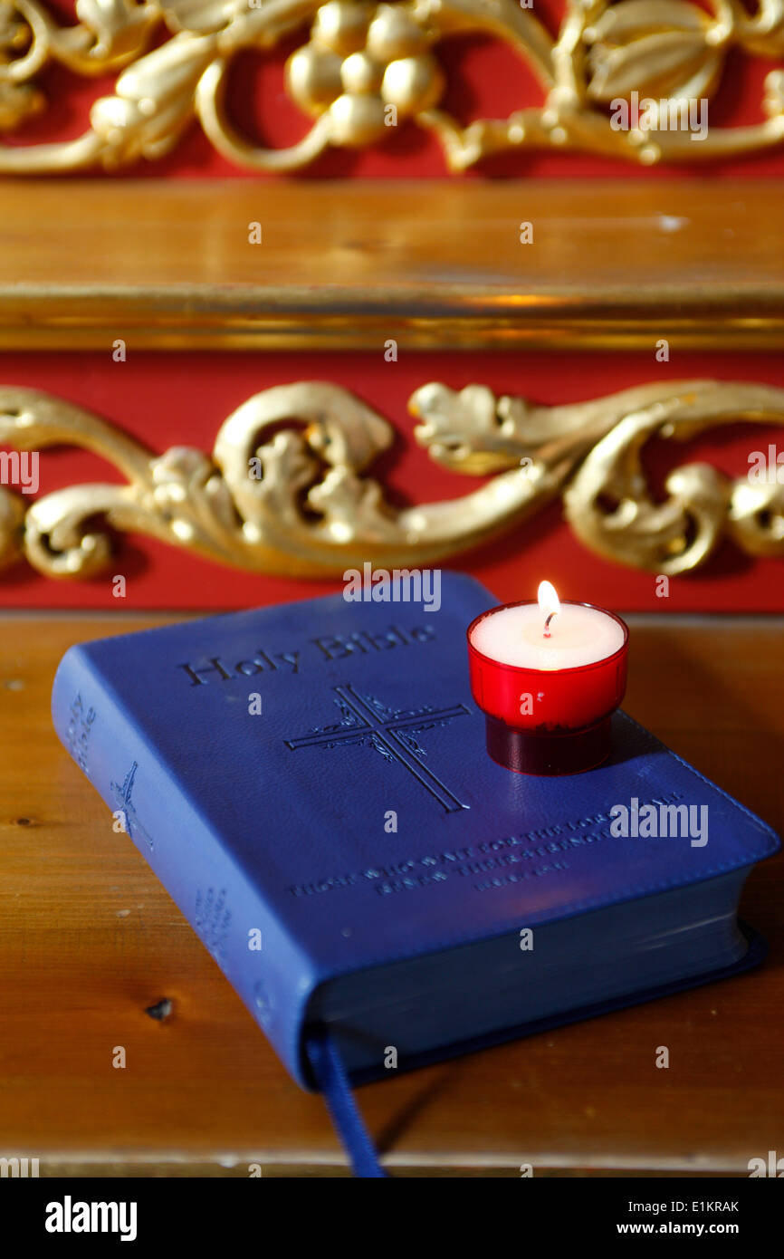 Bible and candle Stock Photo - Alamy