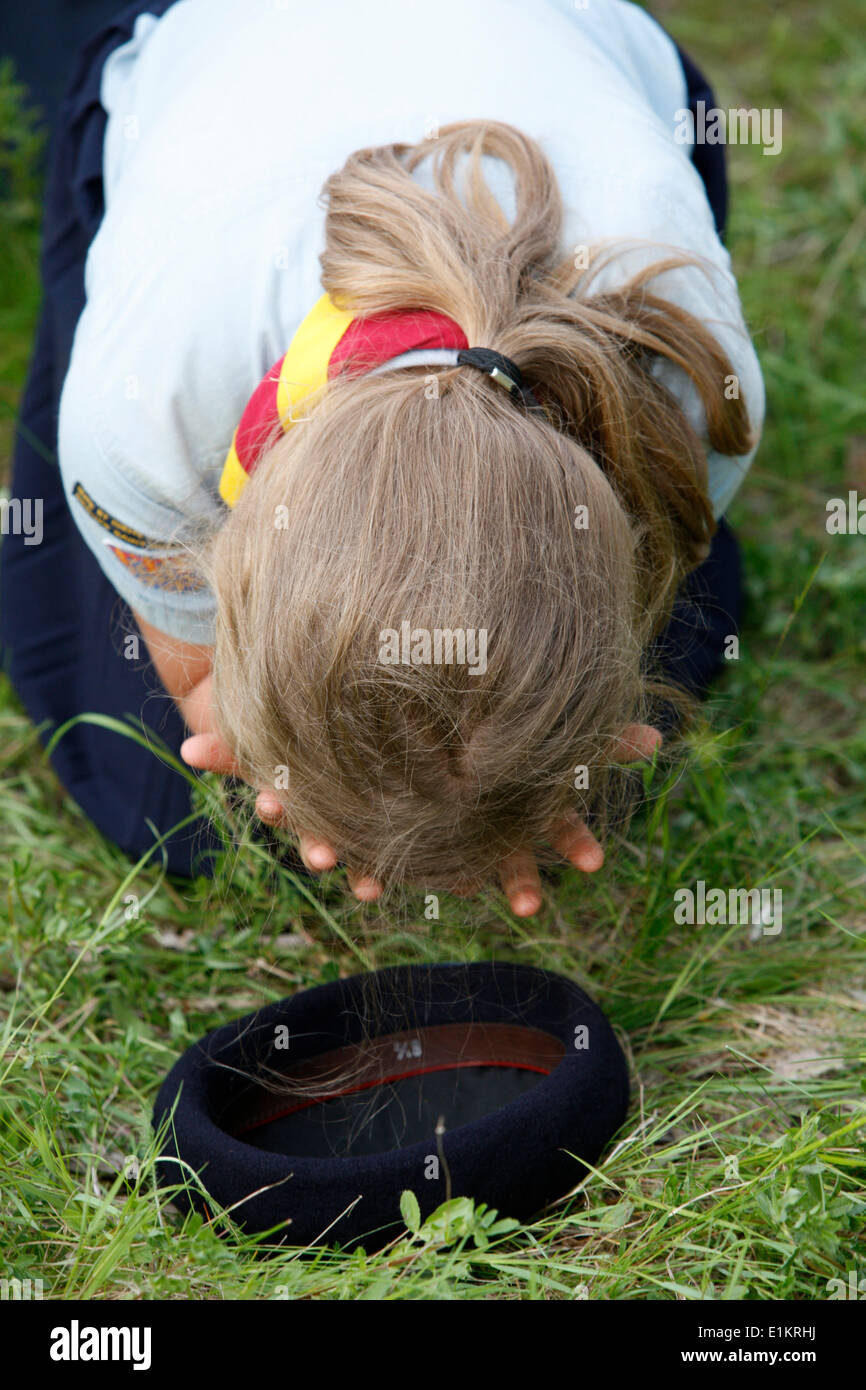 Traditionalist catholic pilgrimage Girl scout praying Stock Photo - Alamy