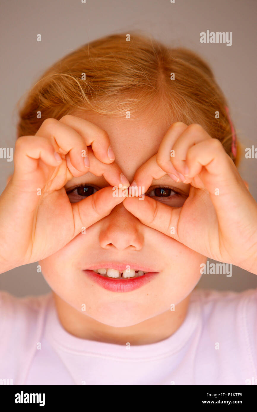 Fingers Around Eyes High Resolution Stock Photography and Images - Alamy