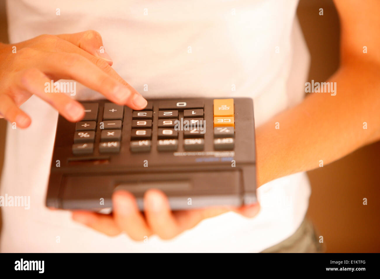 Child using a calculator Stock Photo - Alamy