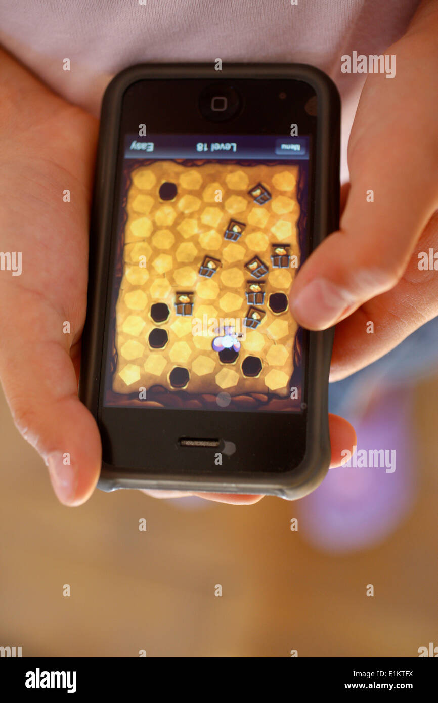 Child using an Iphone Stock Photo - Alamy