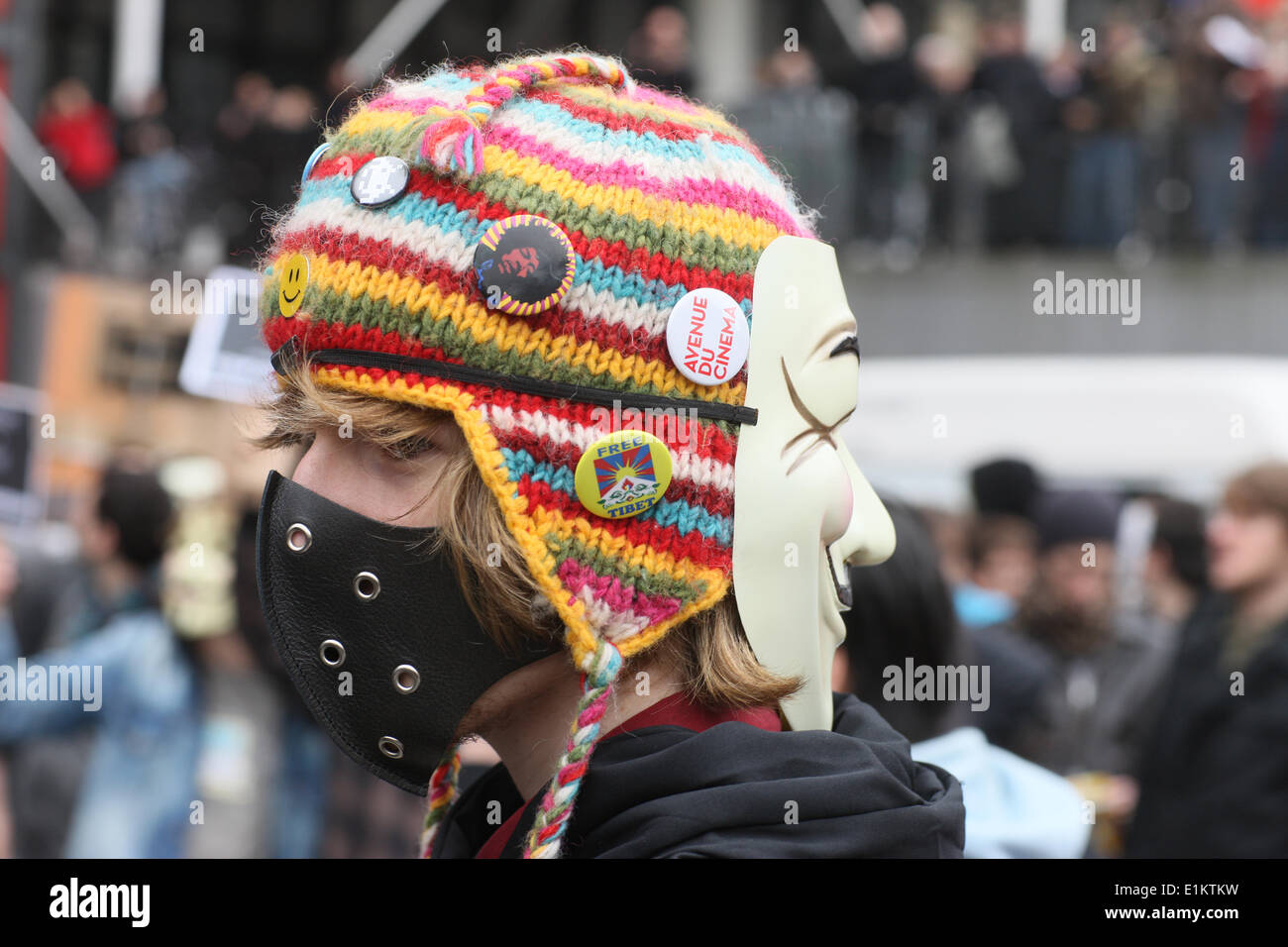 Protester wearing a Guy Fawkes mask , trademark of the Anonymous ...