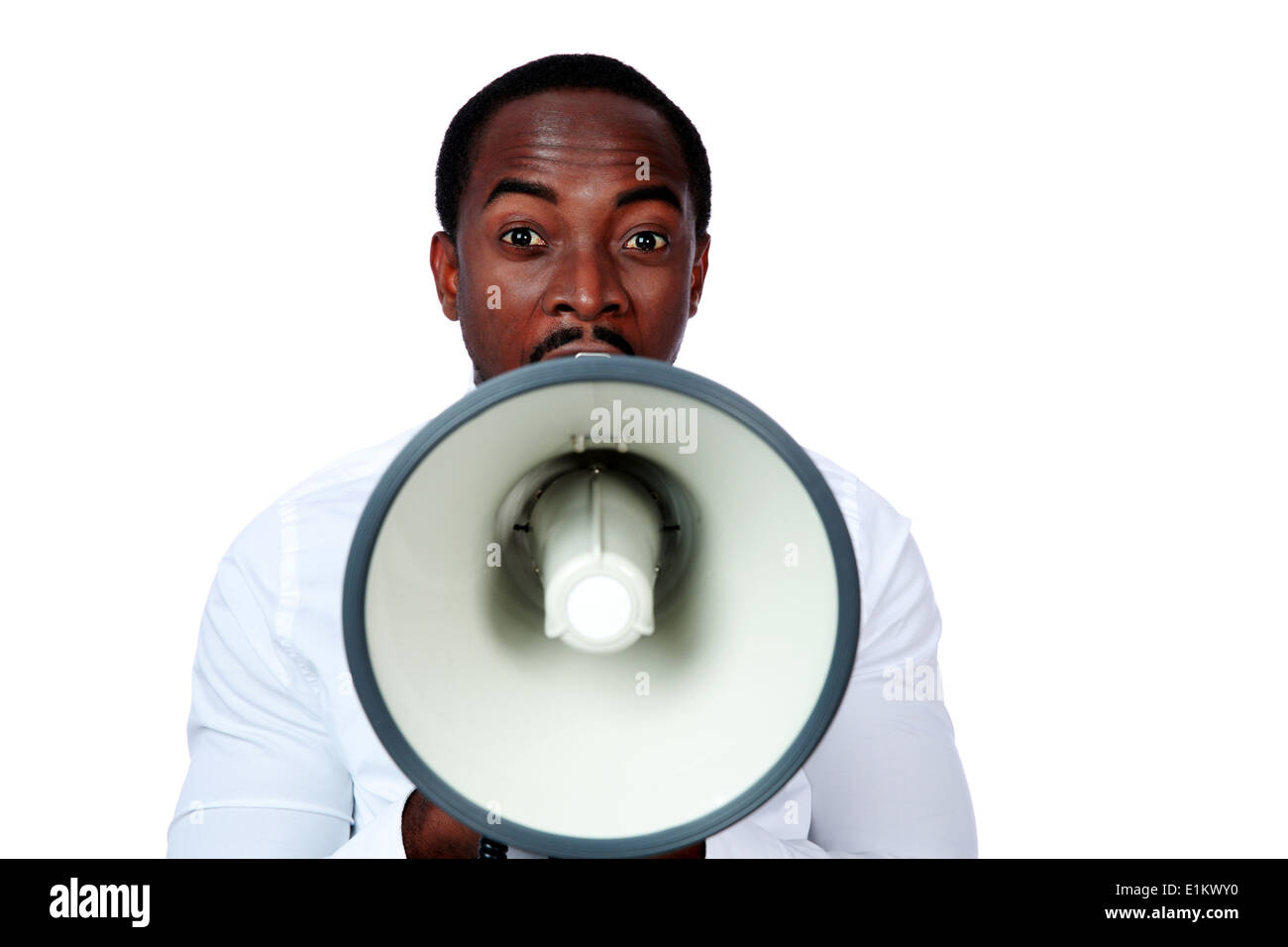 African man shouting through a megaphone isolated on a white background ...