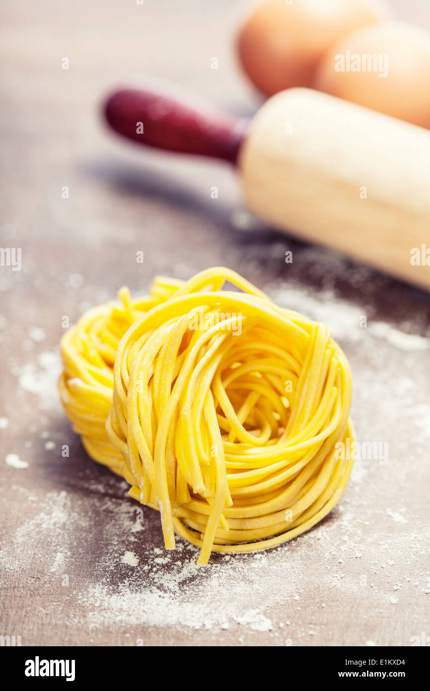 Making homemade pasta on wooden table Stock Photo - Alamy