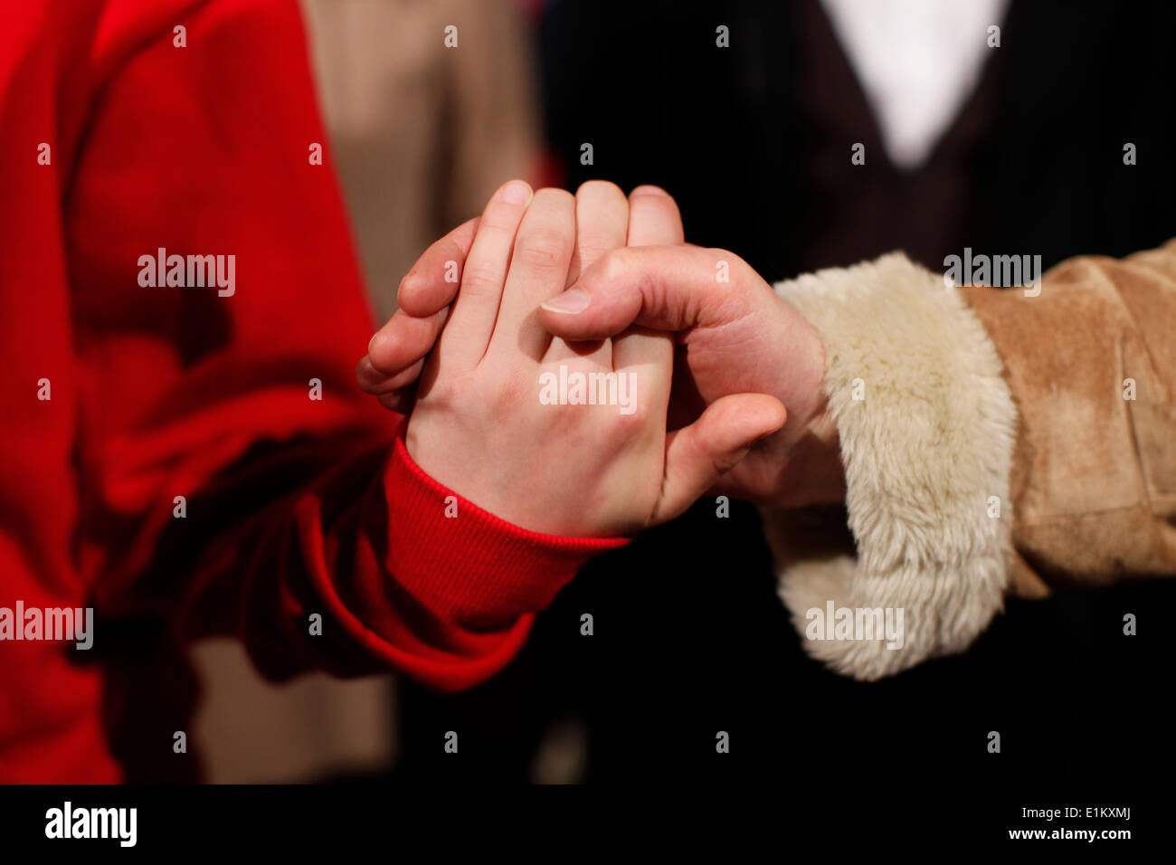 Catholic mass. Faithful holding hands while reciting the Our Father ...