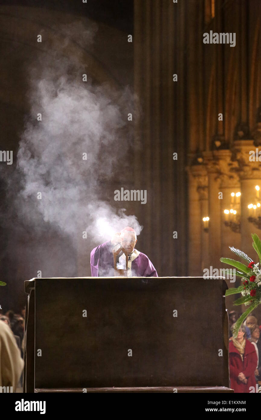 Archbishop censing the altar of Notre Dame Cathedral, Paris Stock Photo ...