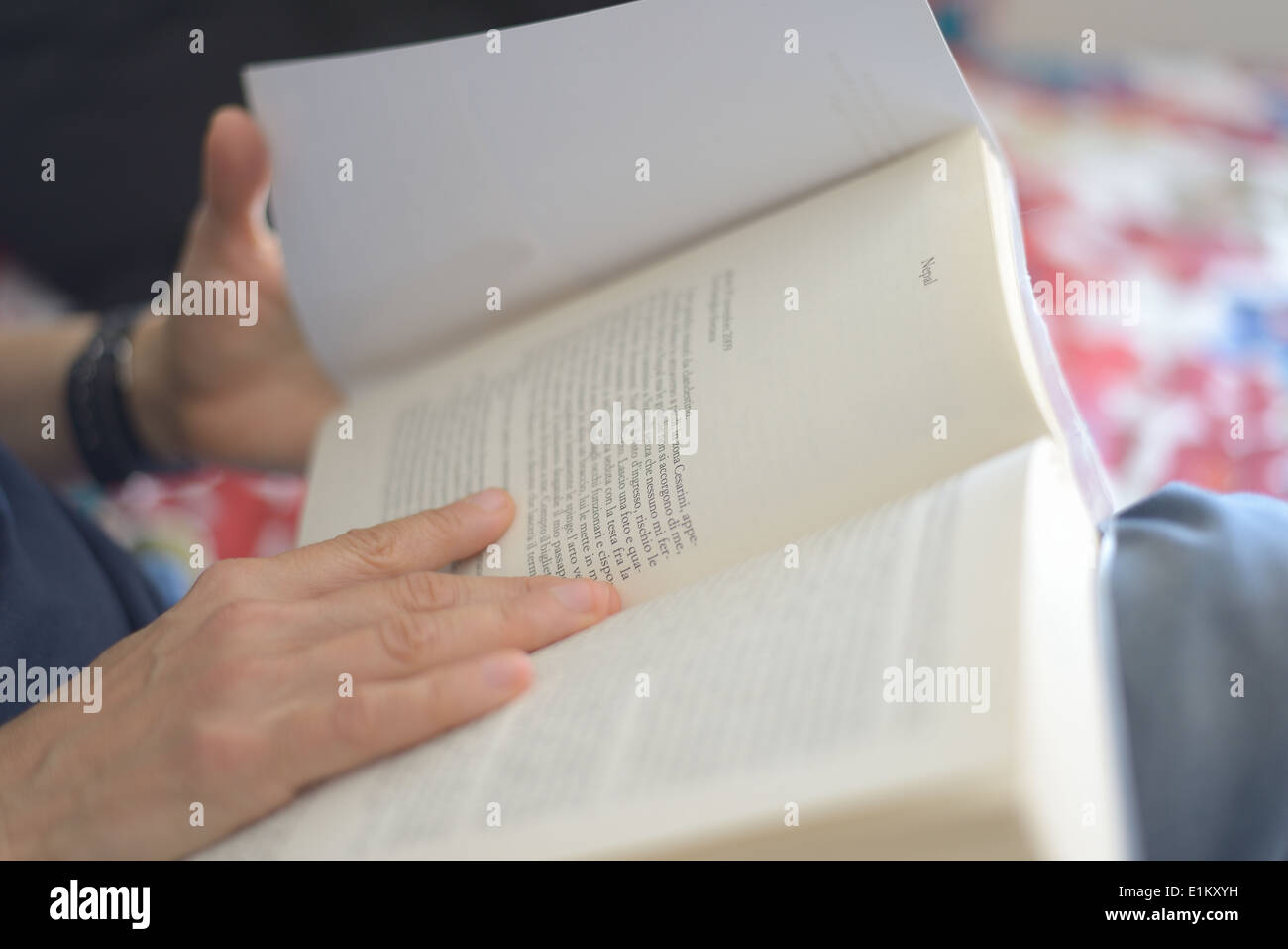 Adult woman reading open book. Selective focus on text Stock Photo - Alamy