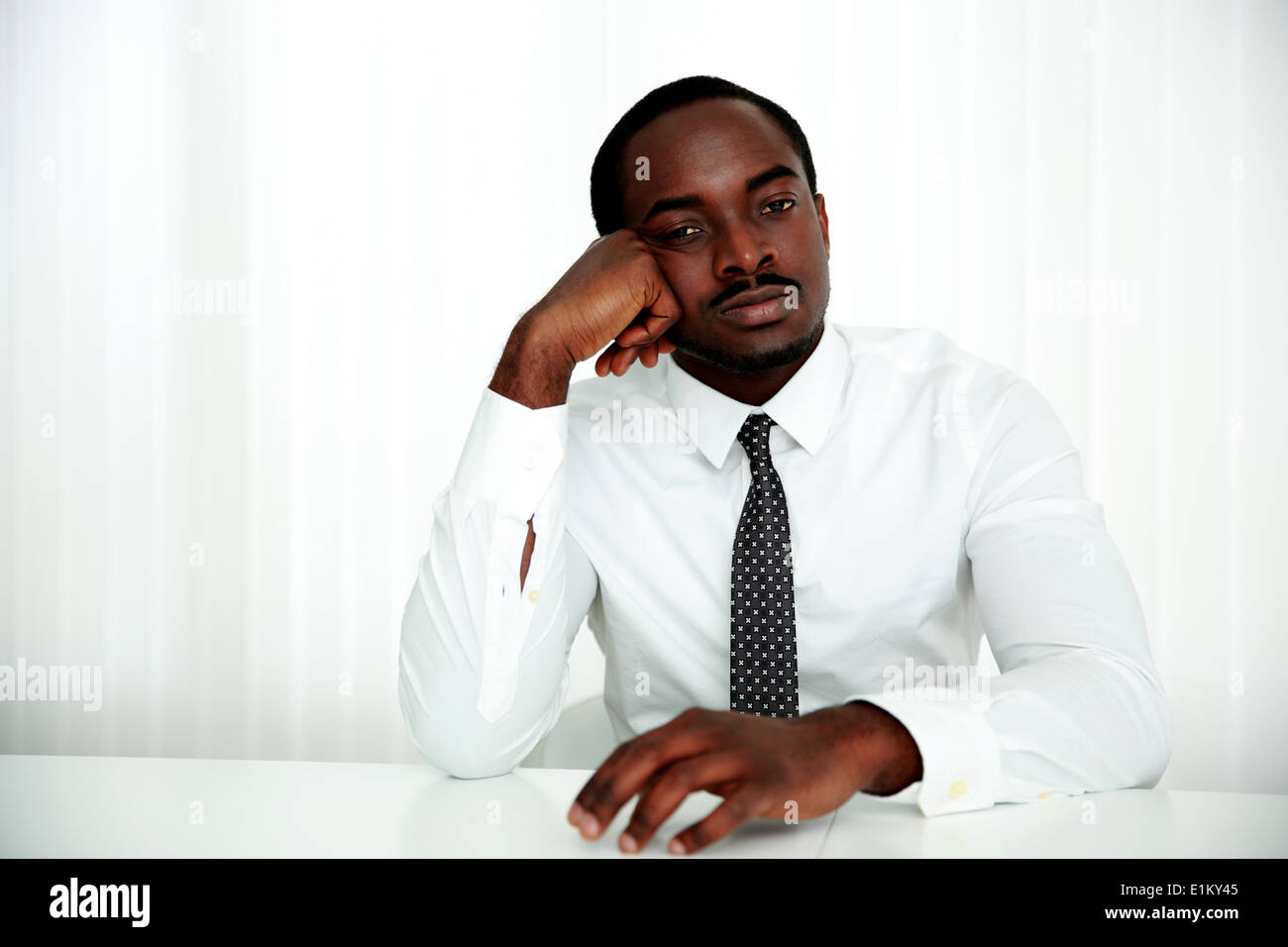 African businessman sitting table hi-res stock photography and images ...