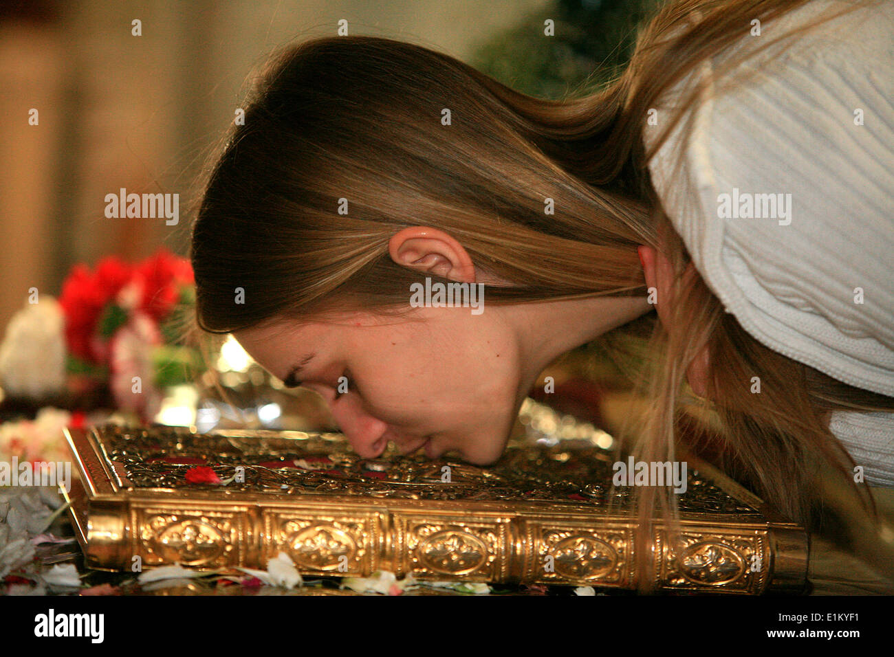 Greek orthodox devotee kissing the bible on the epitaphios on Good ...