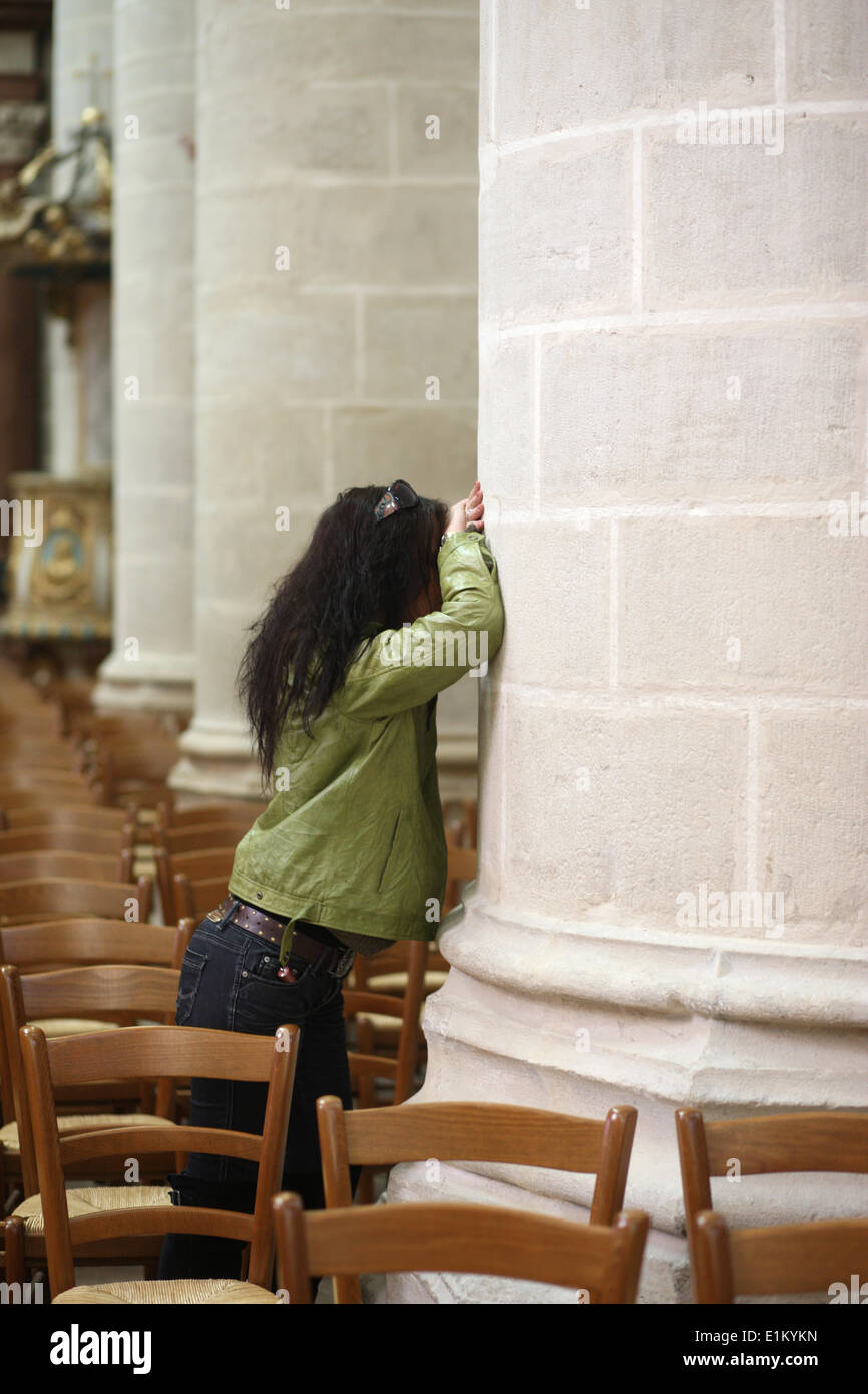 Woman praying in church hi-res stock photography and images - Alamy
