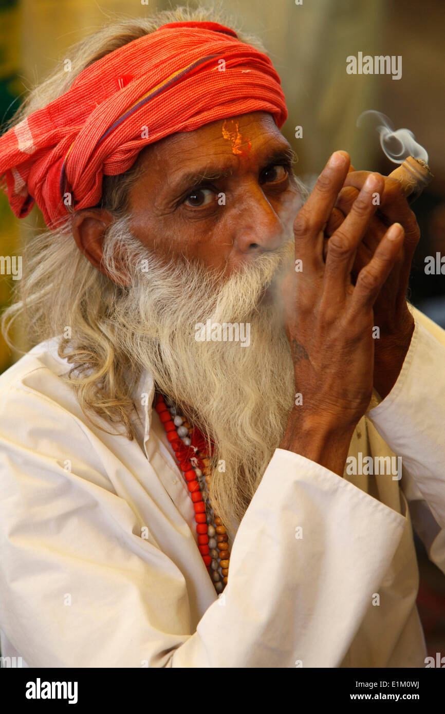 Sadhu smoking cannabis in an akhara at the Kumbh Mela in Haridwar Stock ...