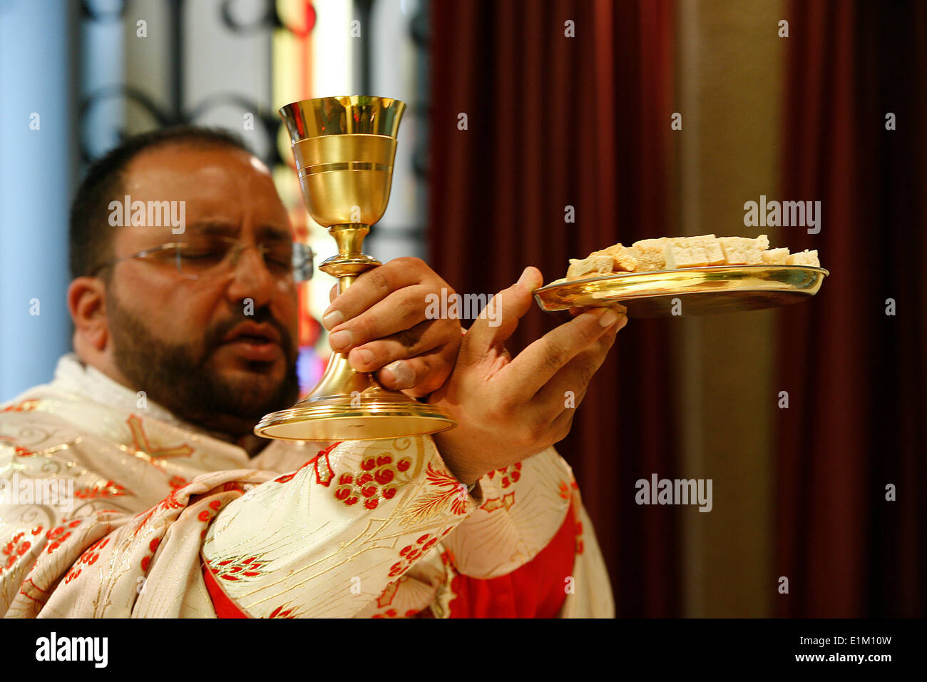 Melkite priest celebrating mass Stock Photo - Alamy
