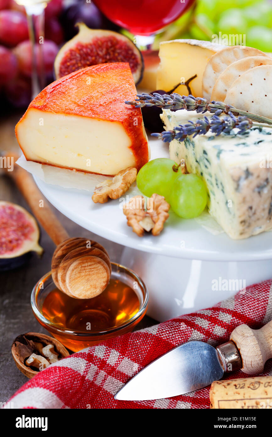 Wine and cheese plate - close up image Stock Photo - Alamy