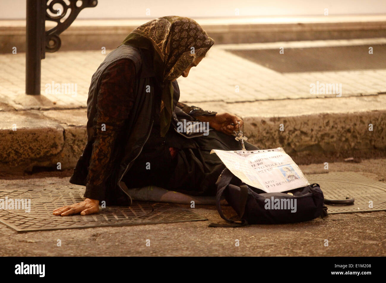 Sitting Beggar High Resolution Stock Photography and Images - Alamy