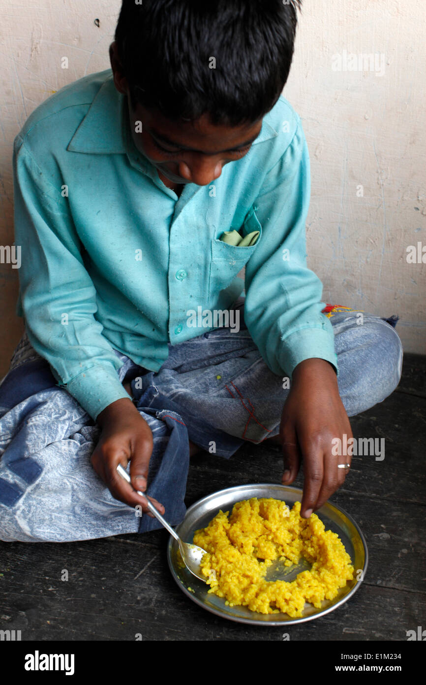 Indian child eating rice hi-res stock photography and images - Alamy