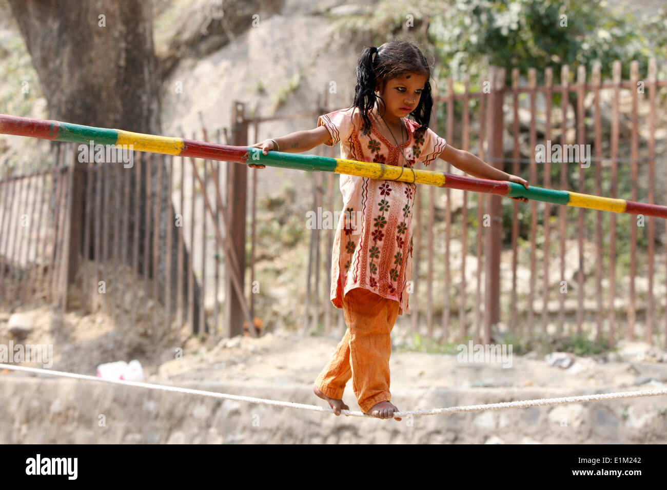 Girl walking tightrope hi-res stock photography and images - Alamy