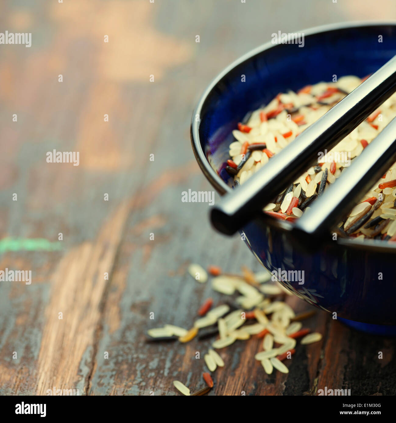 wild rice in ceramic bowl and asian ingredients on wooden background ...