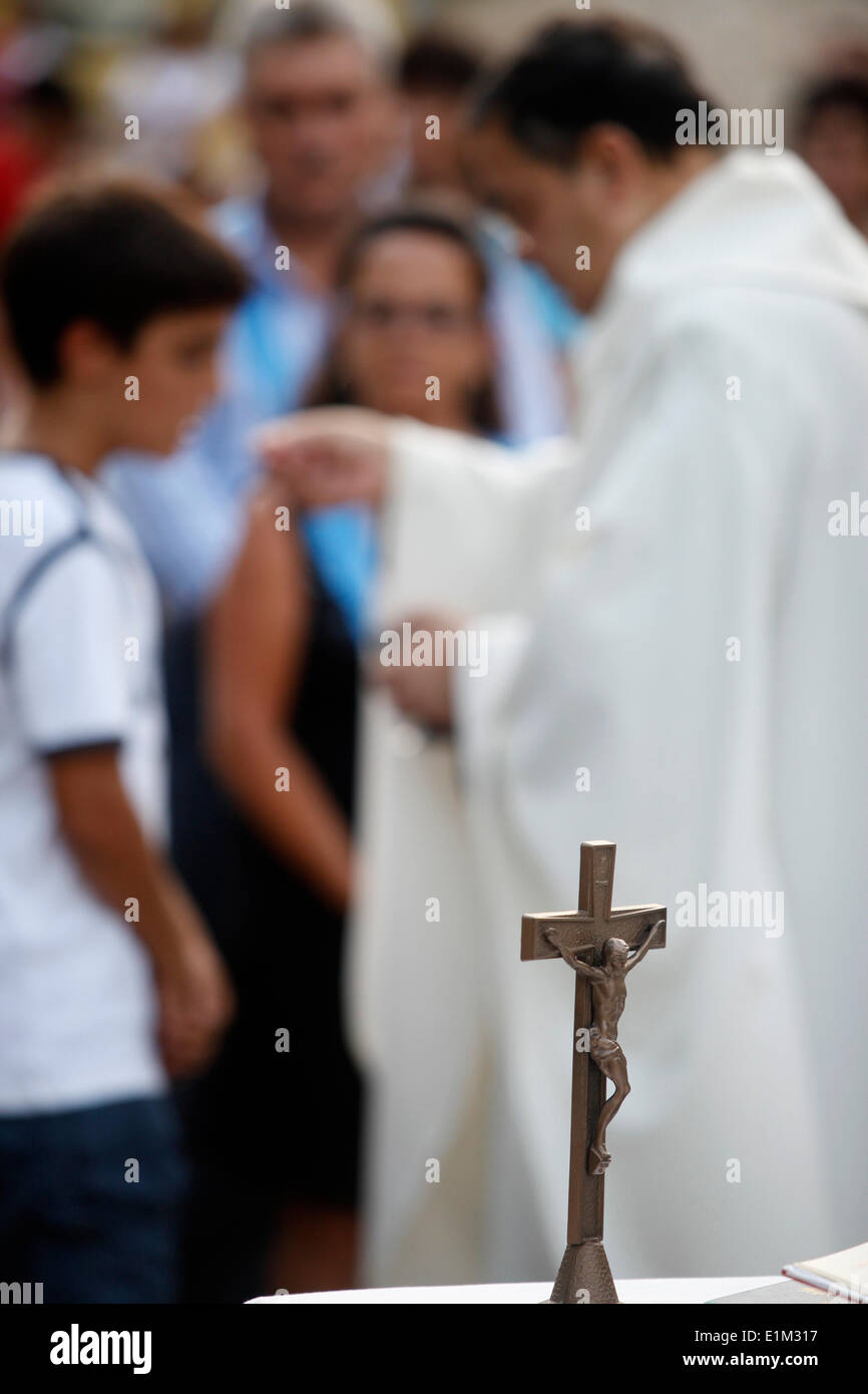 Catholic mass in Marittima, Apulia Holy communion Stock Photo - Alamy