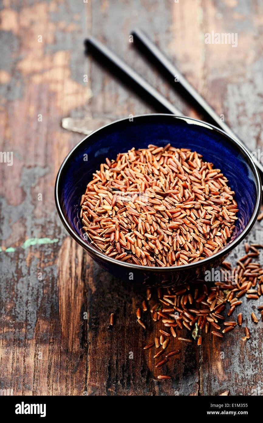 wild rice in ceramic bowl and asian ingredients on wooden background ...