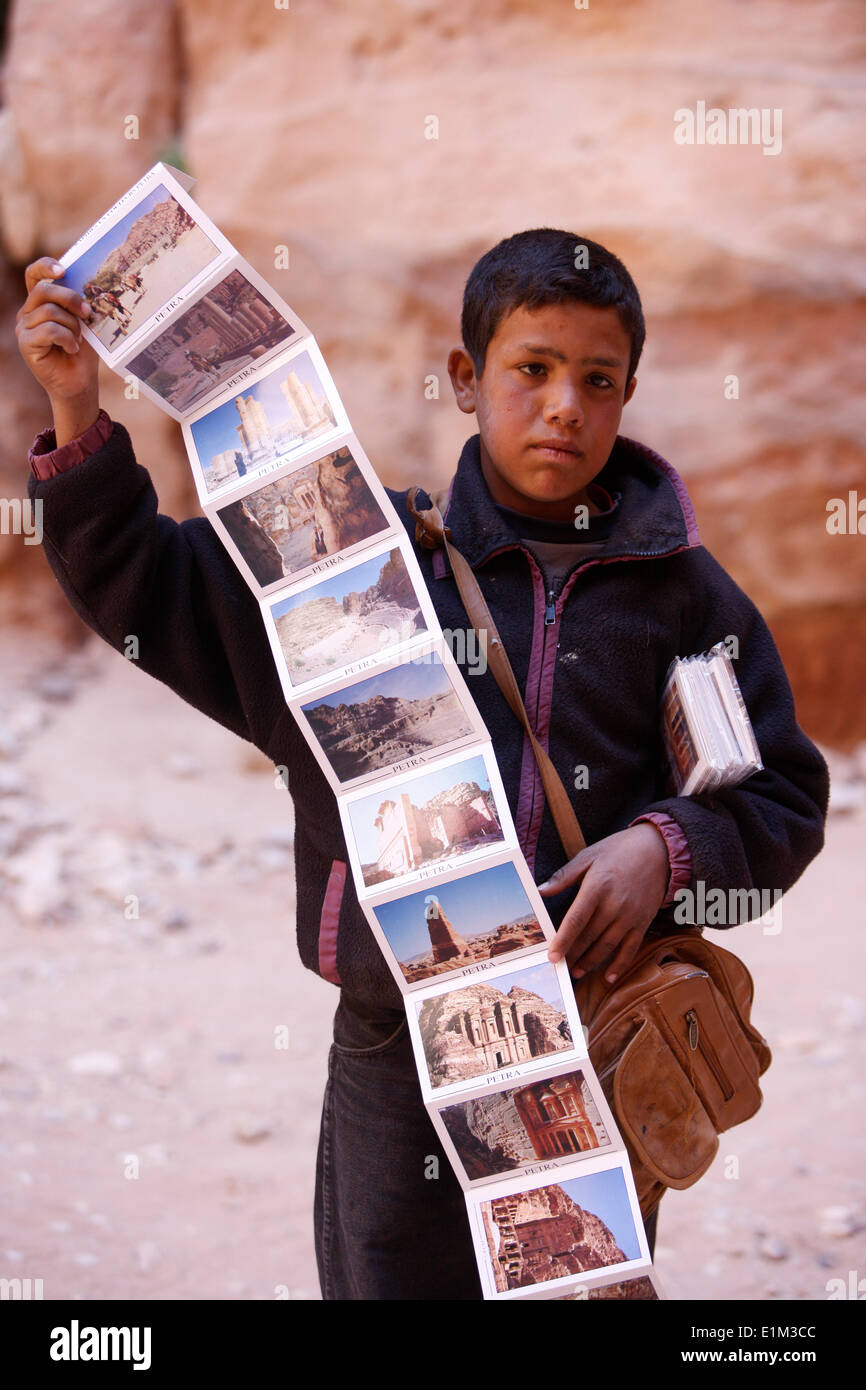 Petra archaeological site : boy selling postcards to tourists Stock ...