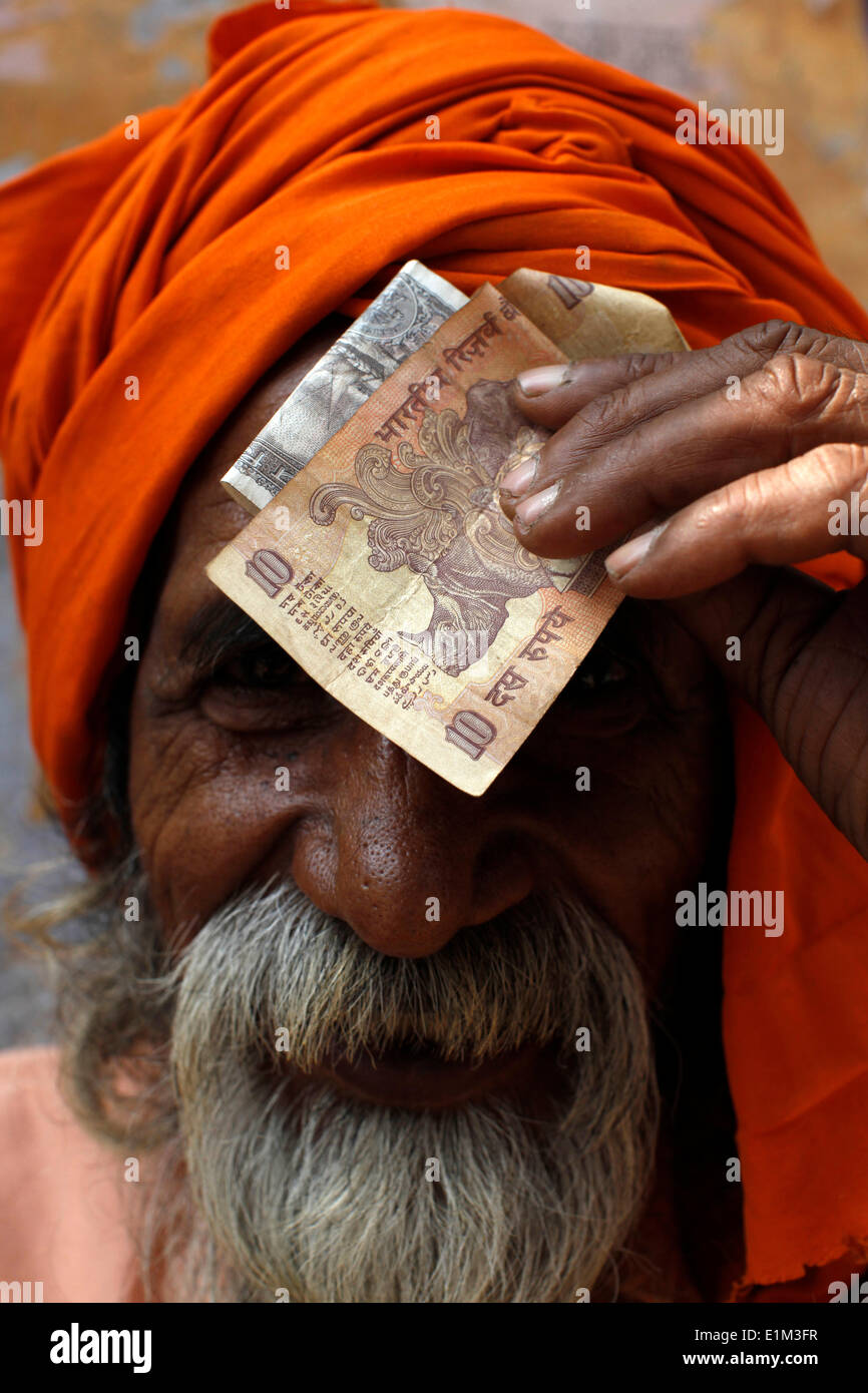 Man Money Forehead High Resolution Stock Photography and Images - Alamy