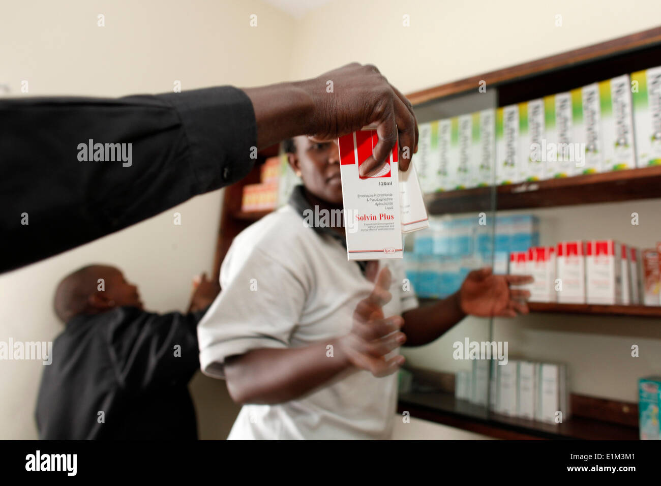Doctor and nurse storing medicine in the Kayole WOFAK (Women Fighting ...