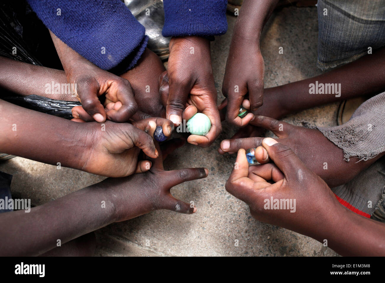 Children playing marbles Stock Photo - Alamy